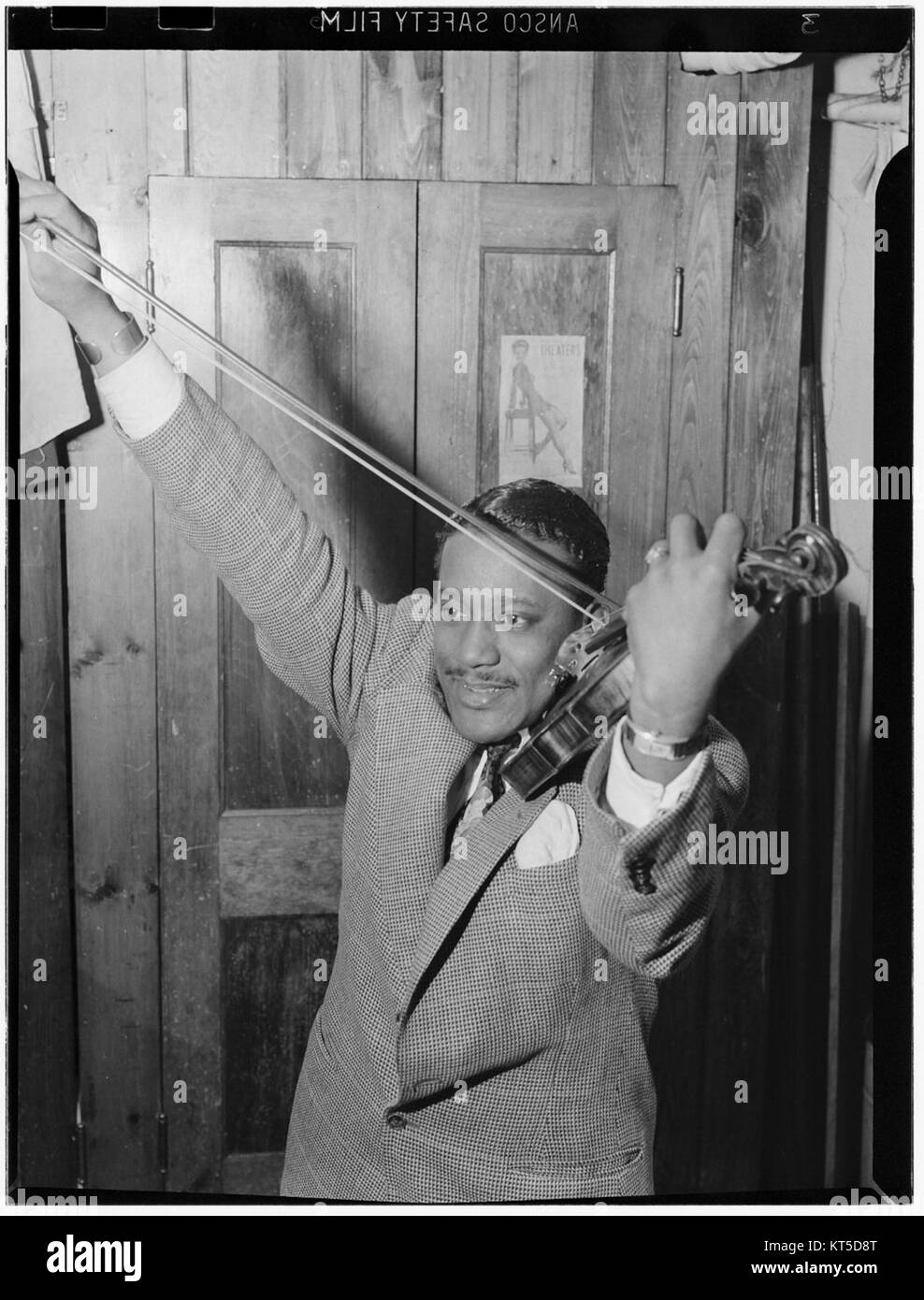 Ray Nance, a jazz musician, is depicted in a photograph taken between ...