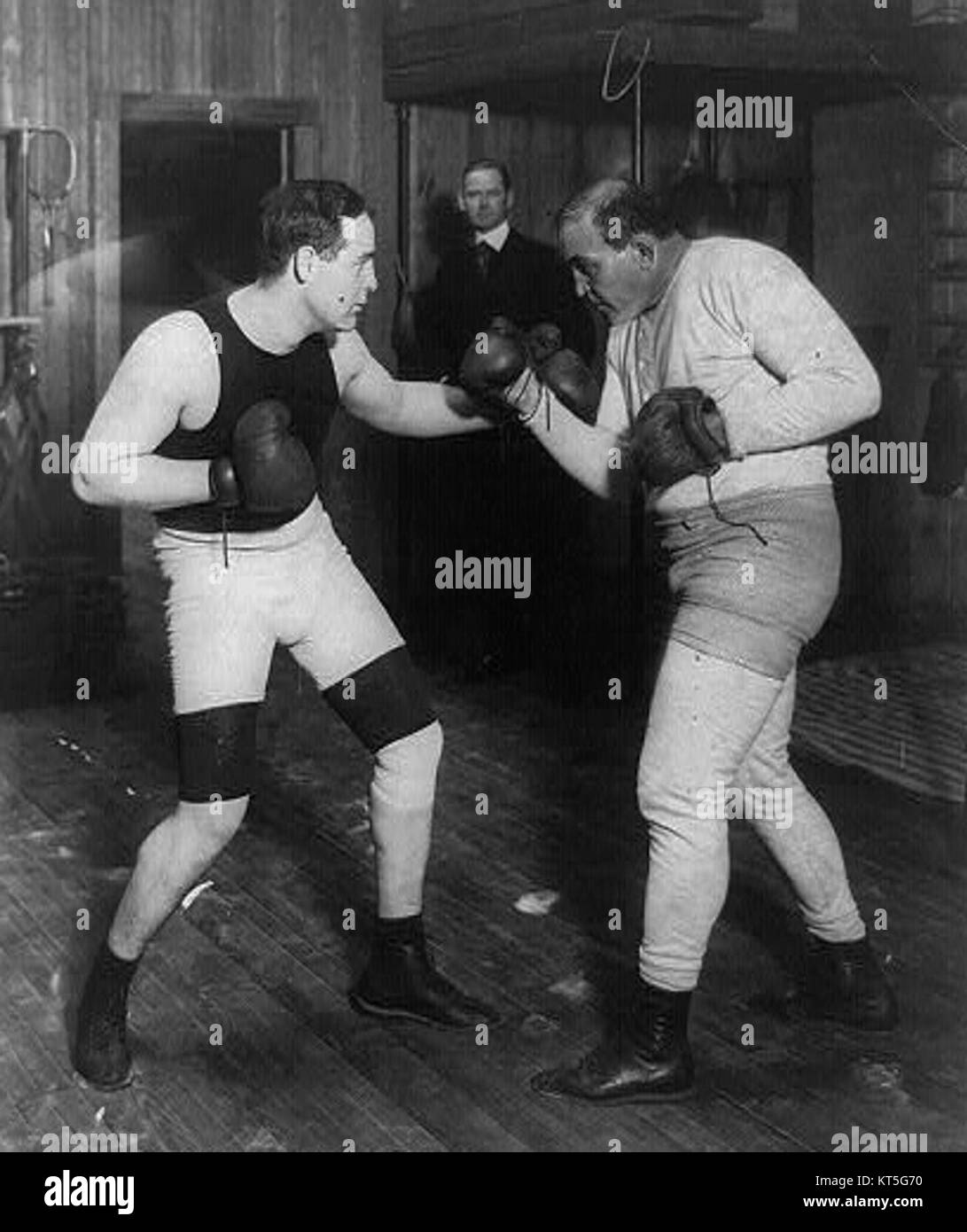A photograph capturing boxers Samuel Berger and James J. Jeffries ...