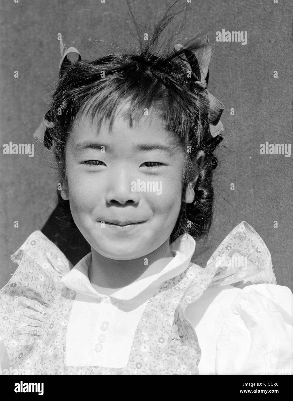 This portrait of Louise Tami Nakamura, taken by Ansel Adams in 1943 ...