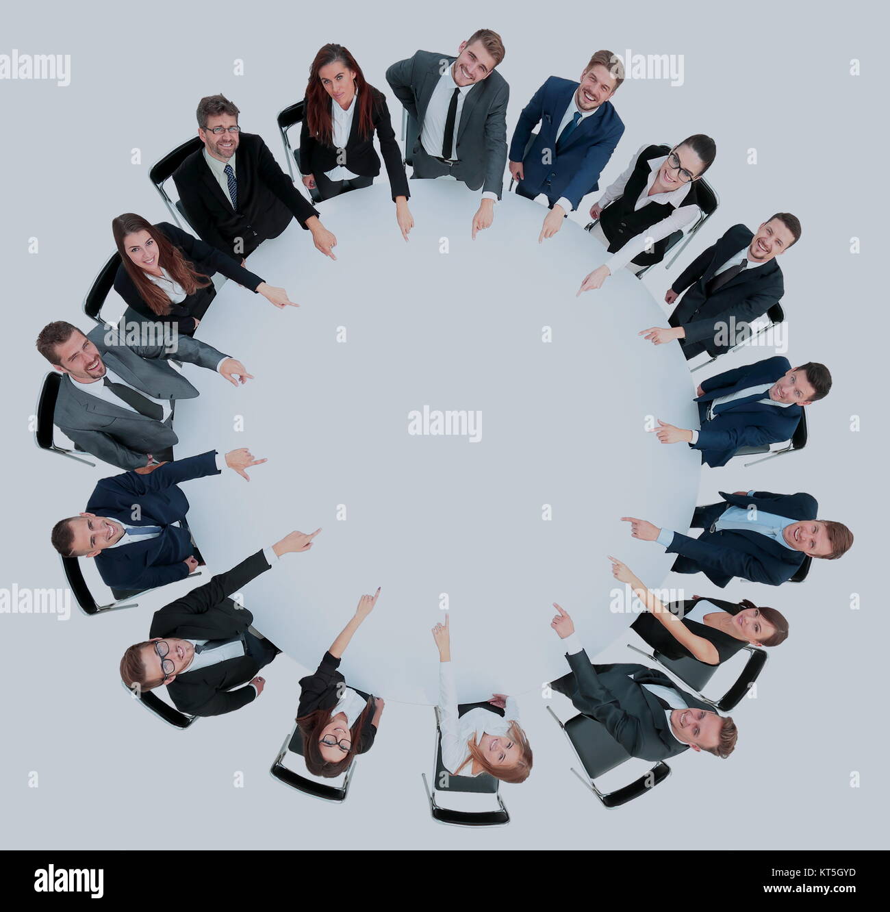 Happy business team pointing at something Stock Photo - Alamy