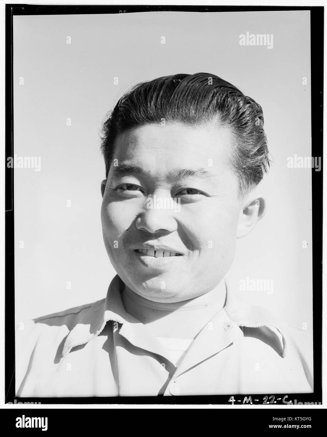 The photograph by Ansel Adams captures Benji Iguchi, a tractor driver ...