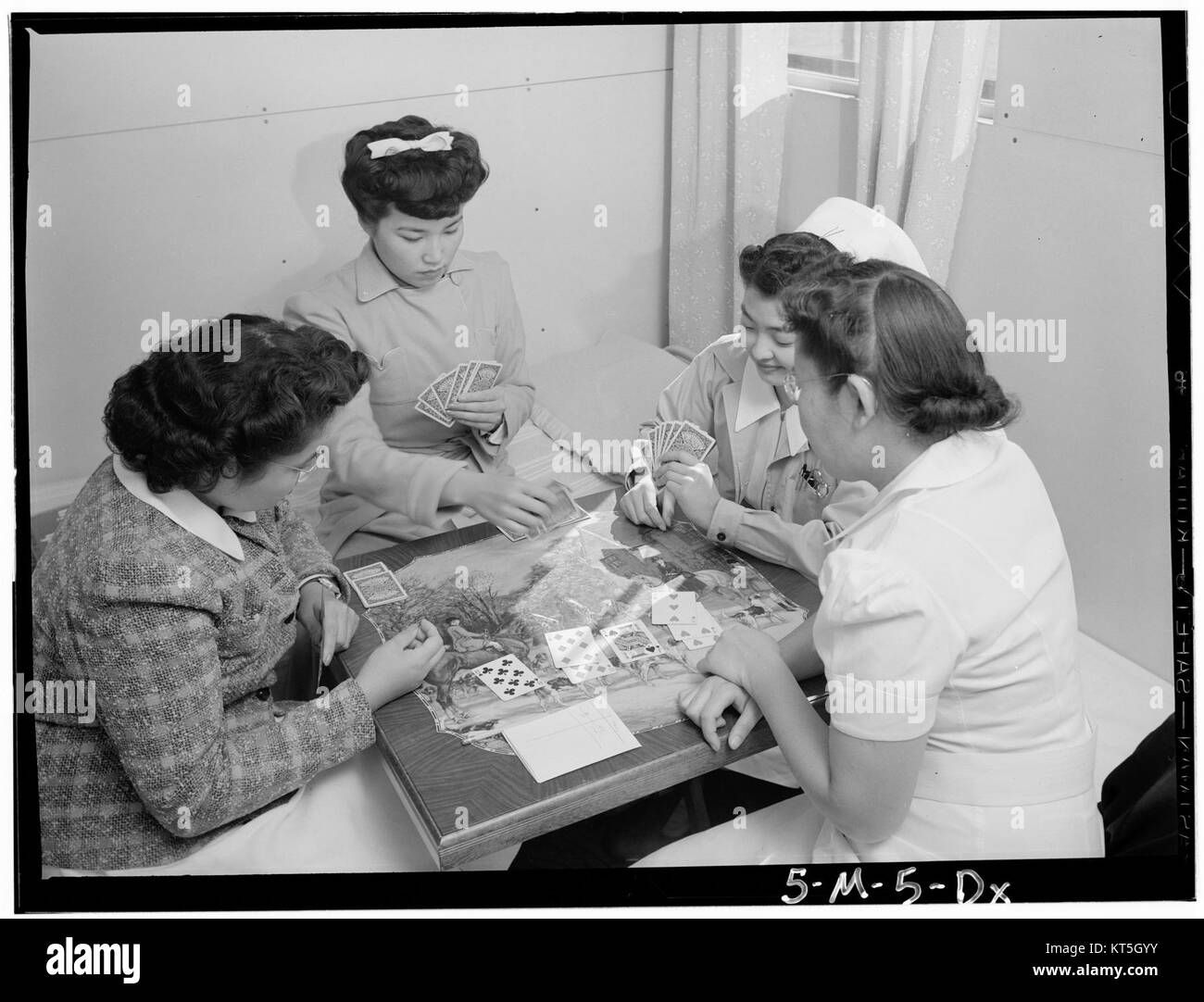 Ansel Adams' photograph titled 'Manzanar - Bridge Game' captures a ...