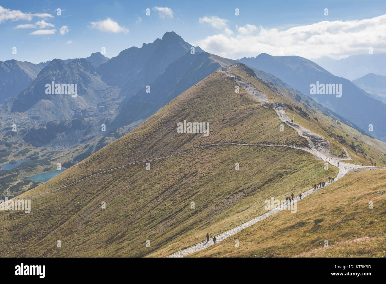 Path on the steep side of Kasprowy Wierch in Tatra mountains and a view ...