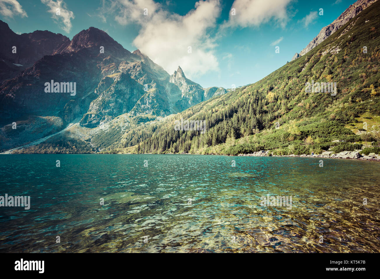 Green water mountain lake Morskie Oko, Tatra Mountains, Poland Stock ...