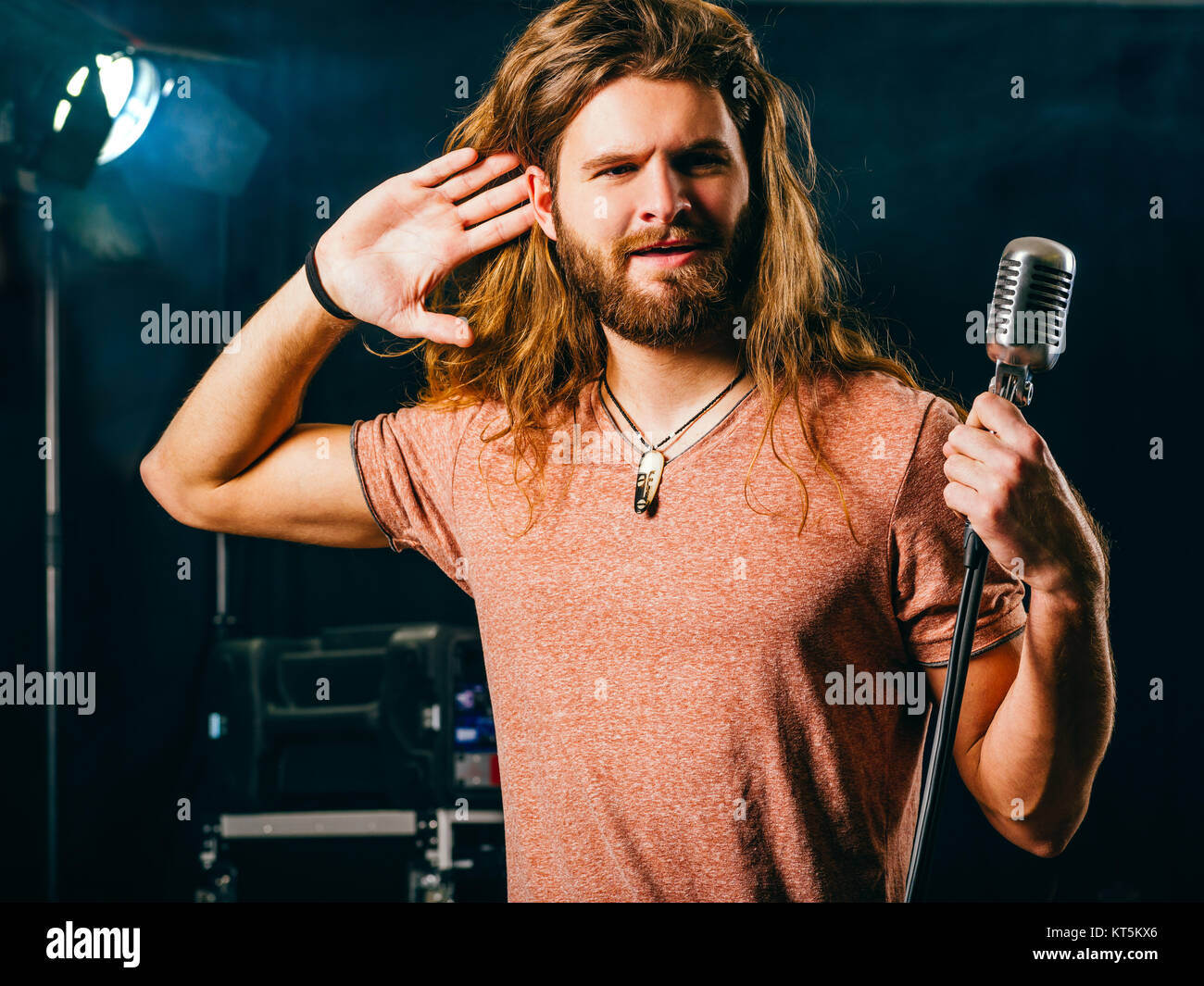 Singer listening to the crowd Stock Photo - Alamy