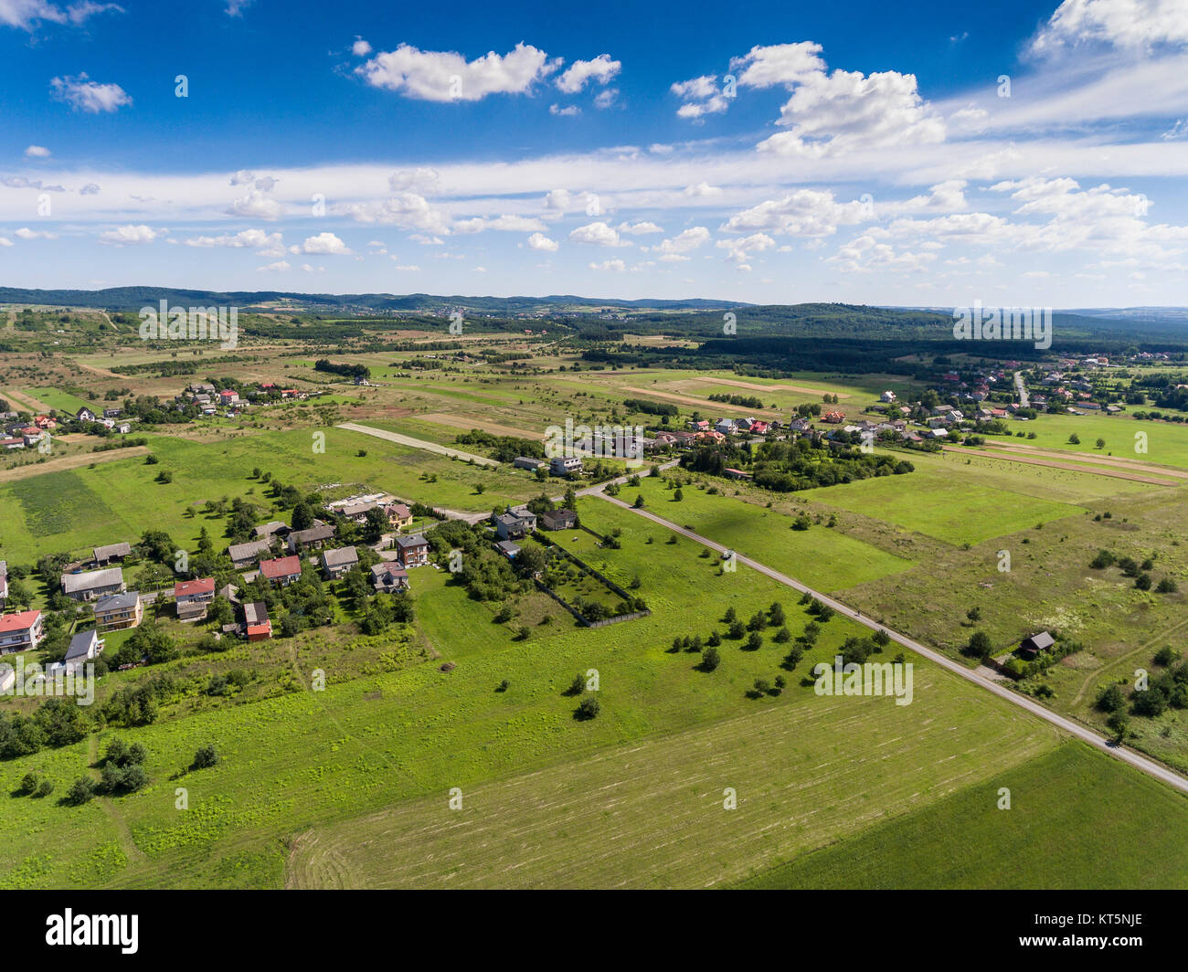 Rural landscape with green hill and blue sky in Poland. View from above ...