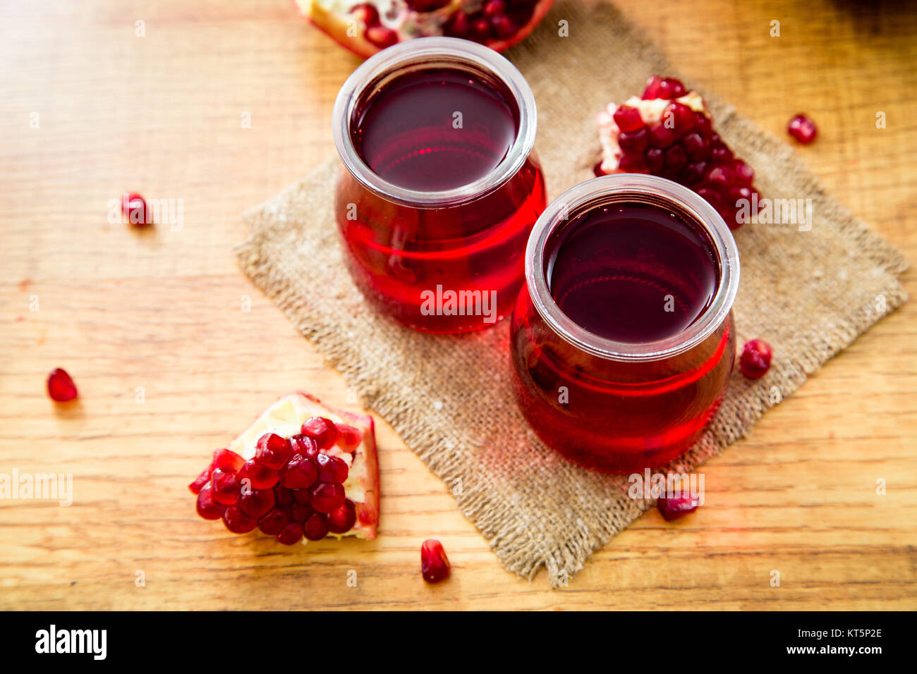 Pomegranate liqueur, Pomegranate juice. old wooden background ...