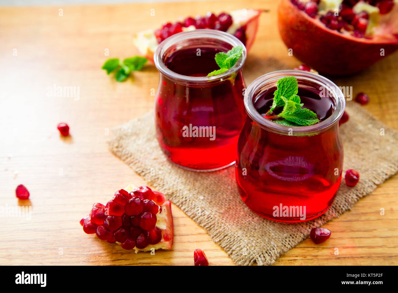 Pomegranate liqueur, Pomegranate juice. old wooden background ...