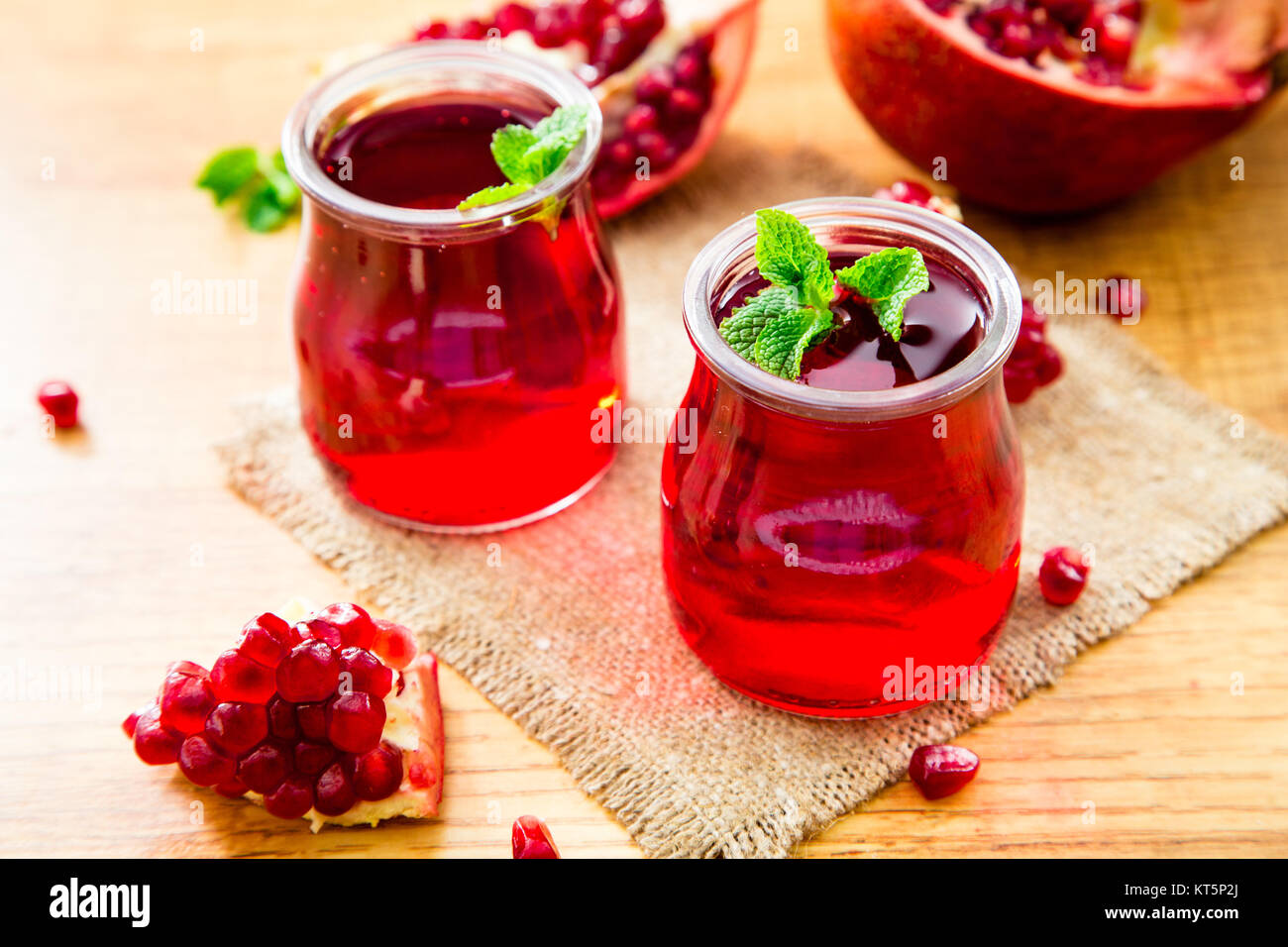 Pomegranate liqueur, Pomegranate juice. old wooden background ...