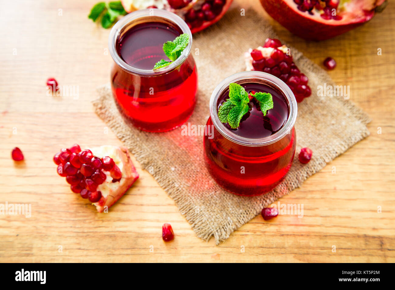 Pomegranate liqueur, Pomegranate juice. old wooden background ...