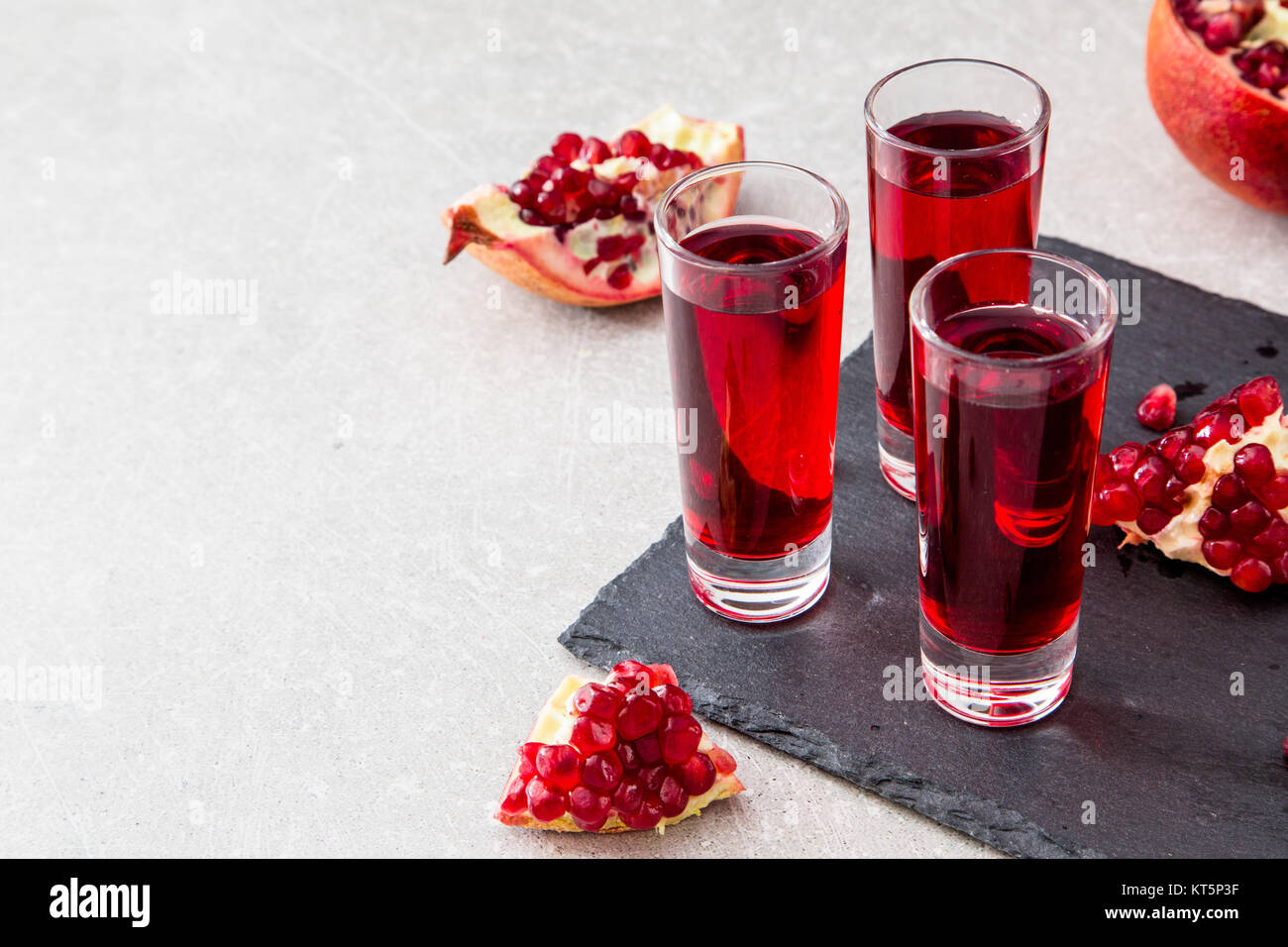 Pomegranate liqueur, Pomegranate juice. old wooden background ...