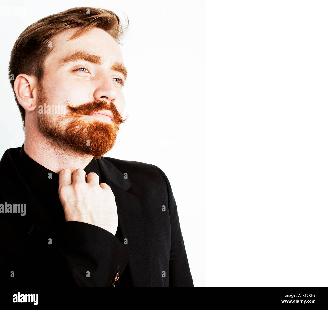 young red hair man with beard and mustache in black suit on white ...