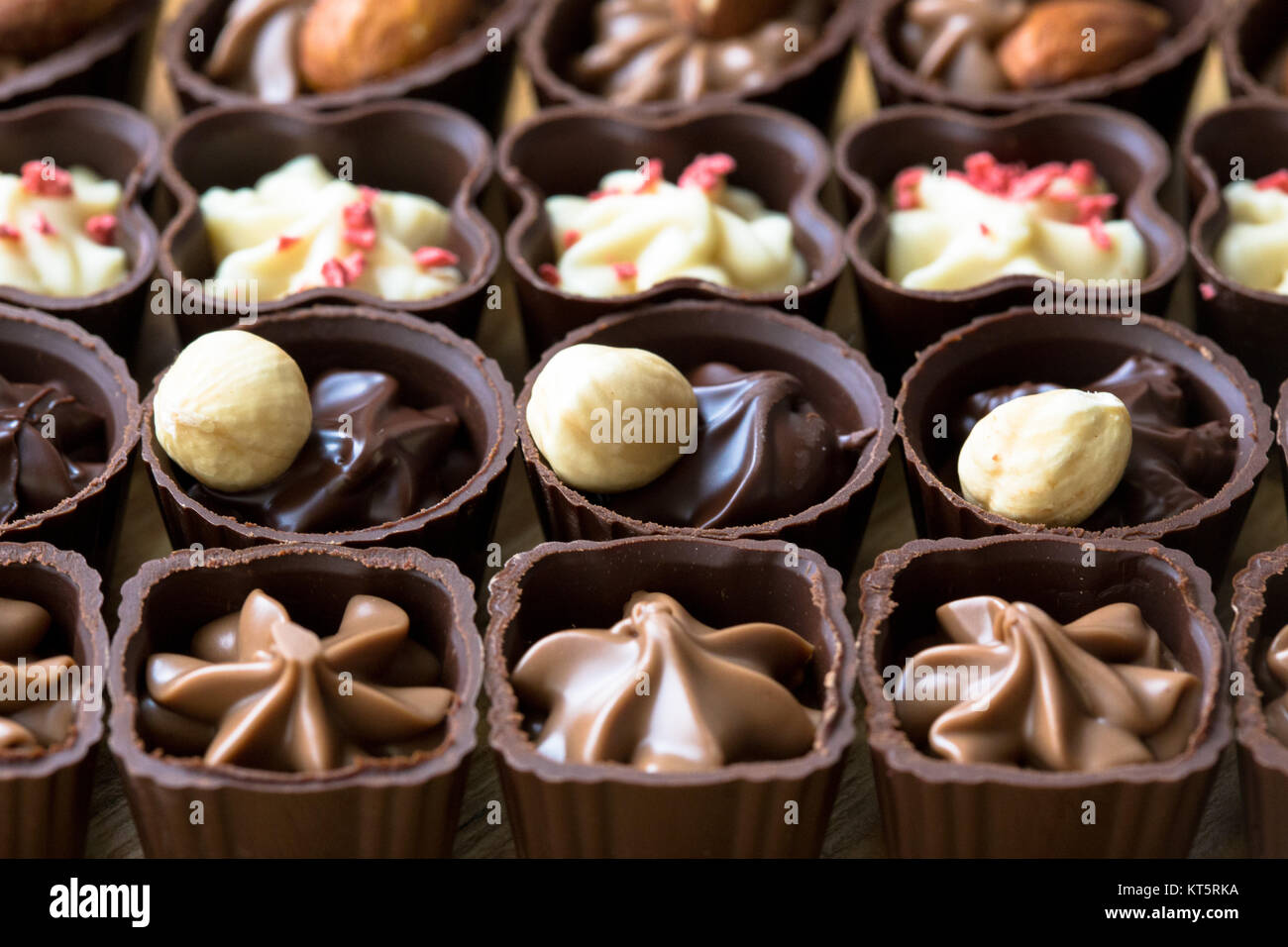 various chocolates as a background - sweet food Stock Photo - Alamy