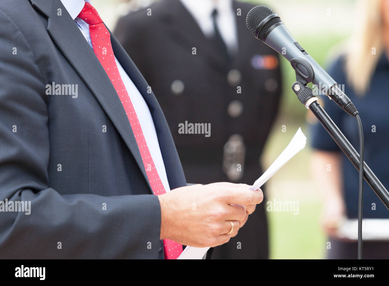 Speaking microphone suit politics hi-res stock photography and images ...
