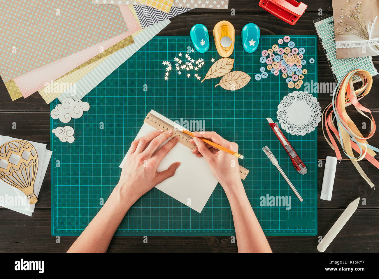 cropped image of woman measuring paper Stock Photo - Alamy