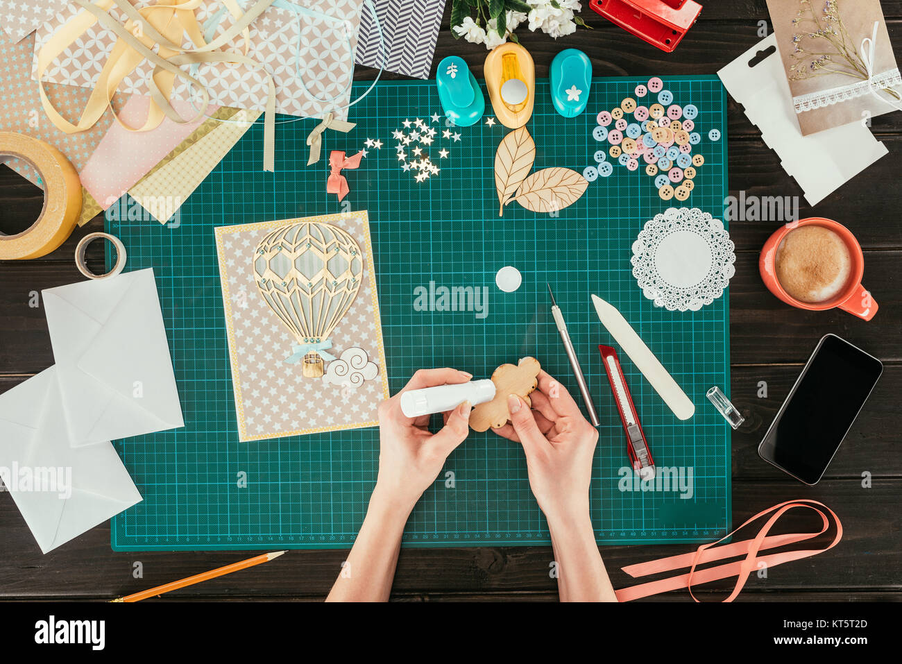 cropped image of woman applying glue on decoration part Stock Photo - Alamy