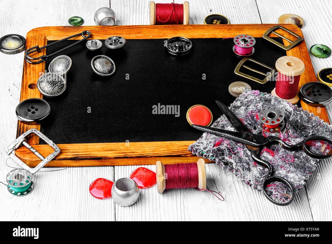 Set of buttons and sewing thread on the chalk board for drawing Stock ...