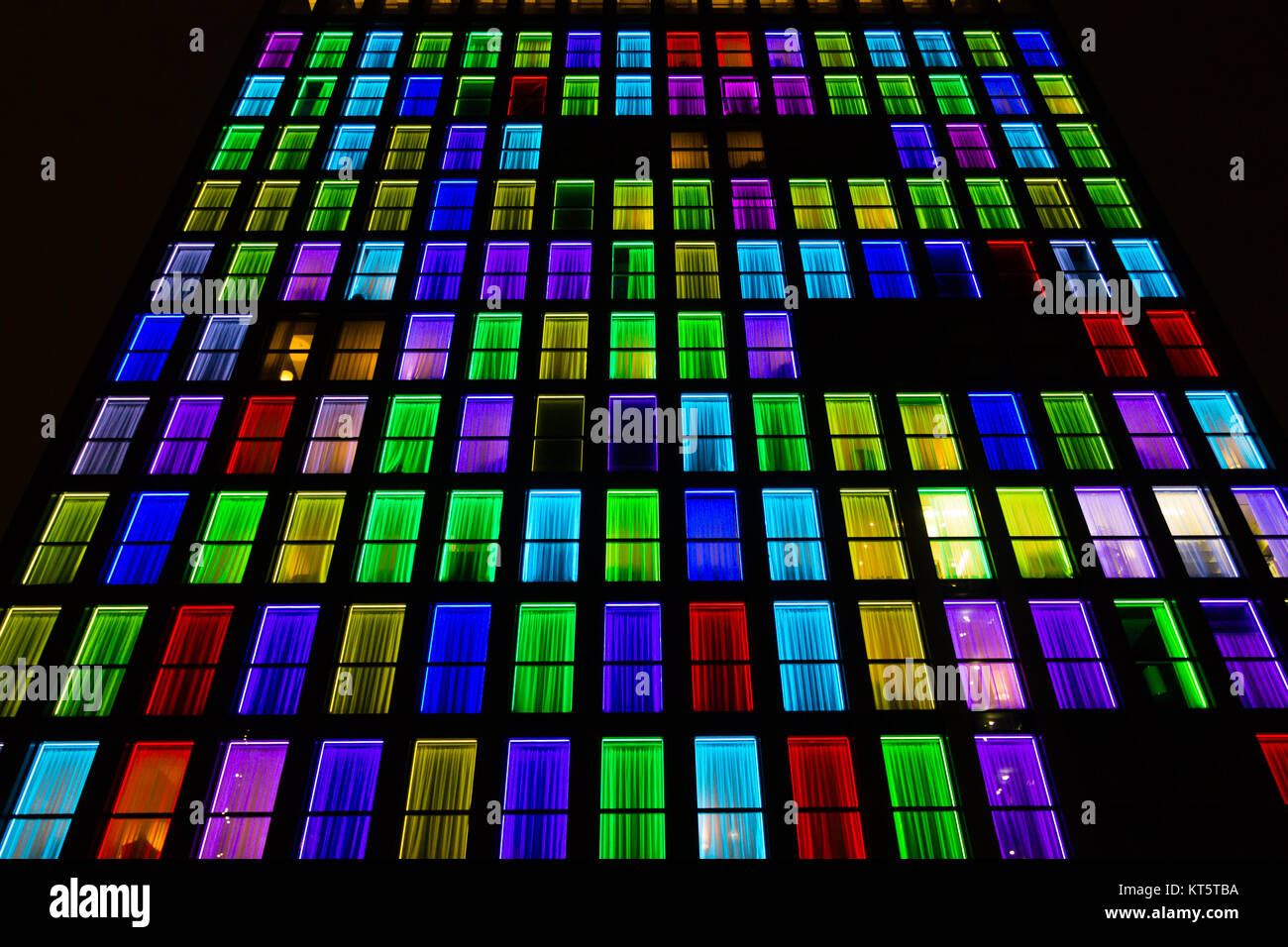 Colored windows texture. Windows illuminated by neon lights background ...