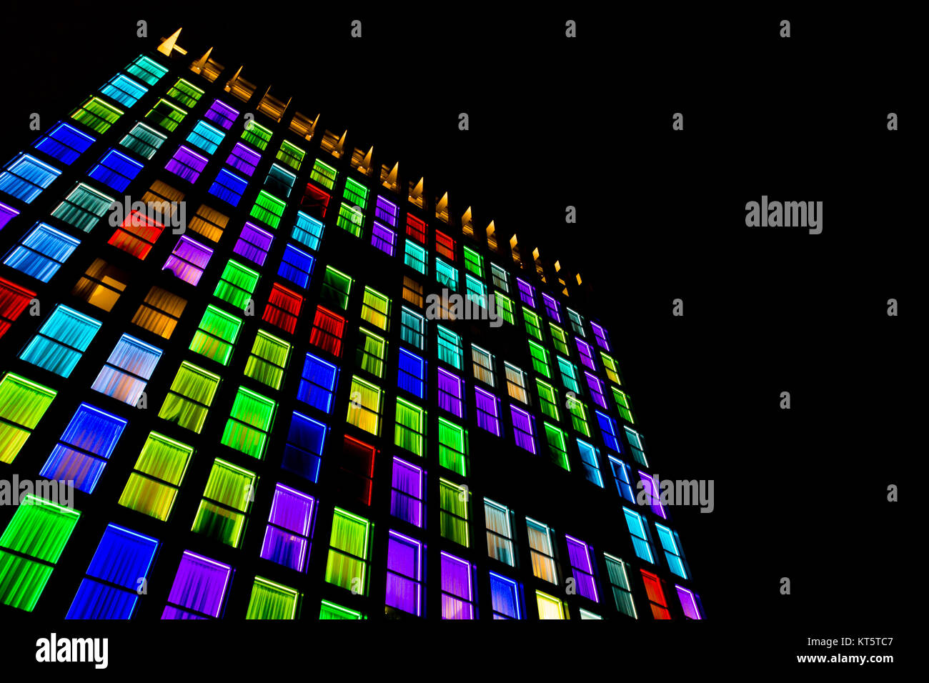Colored windows texture. Windows illuminated by neon lights background ...