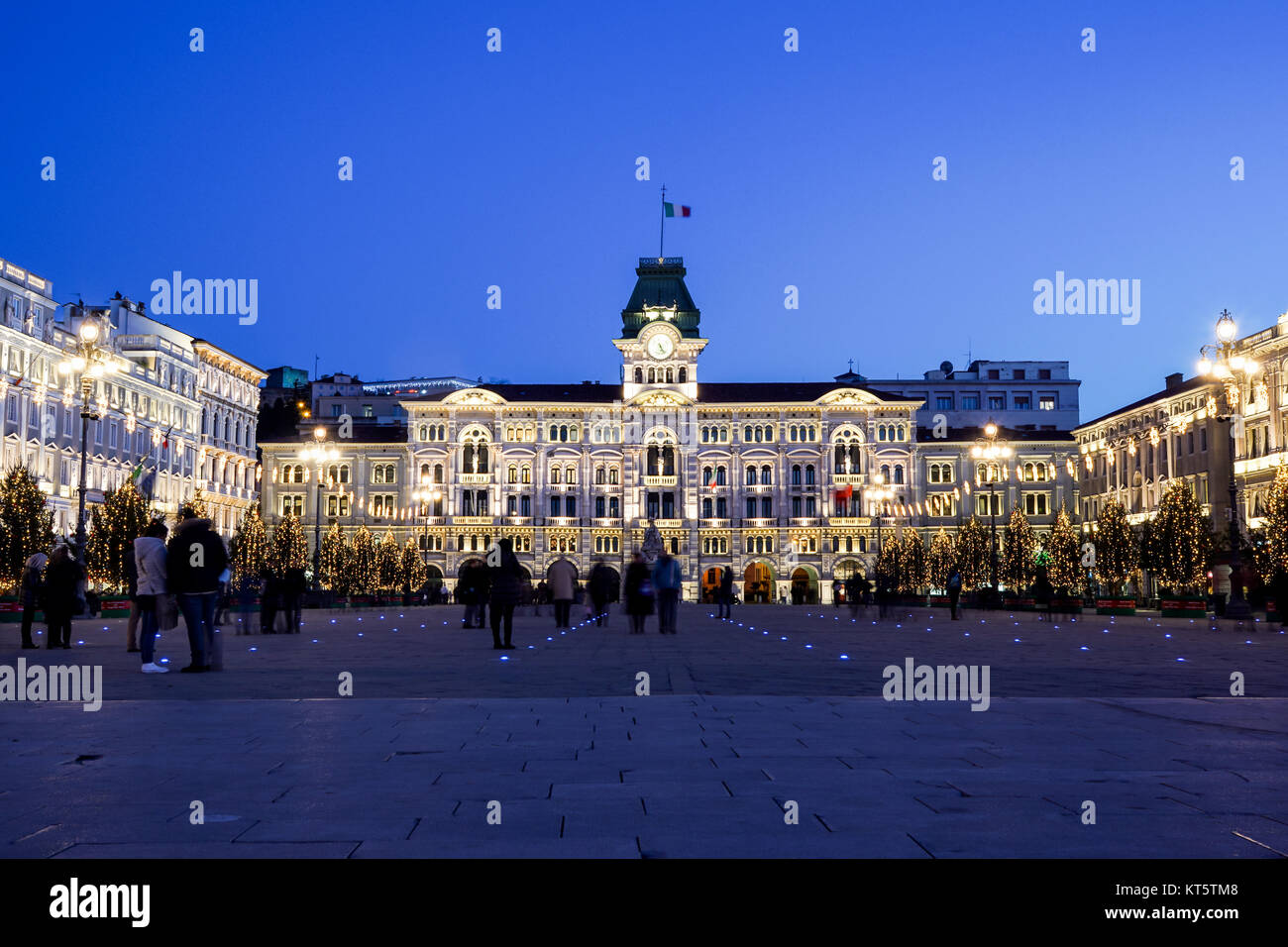 Night walk between the buildings of Trieste and the sea Stock Photo - Alamy