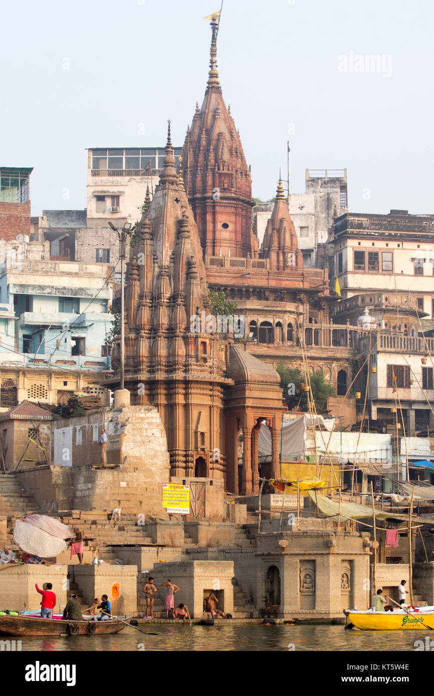 Ancient Hindu temples line the banks of the the holy River Ganges, in ...