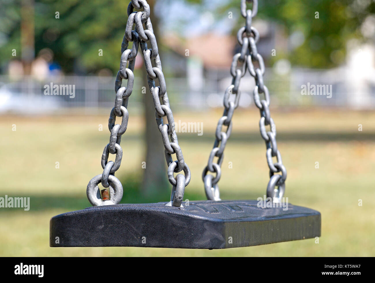 empty chain swing in the playground at park Stock Photo - Alamy