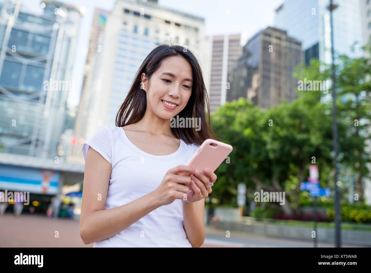 Woman using mobile phone Stock Photo - Alamy