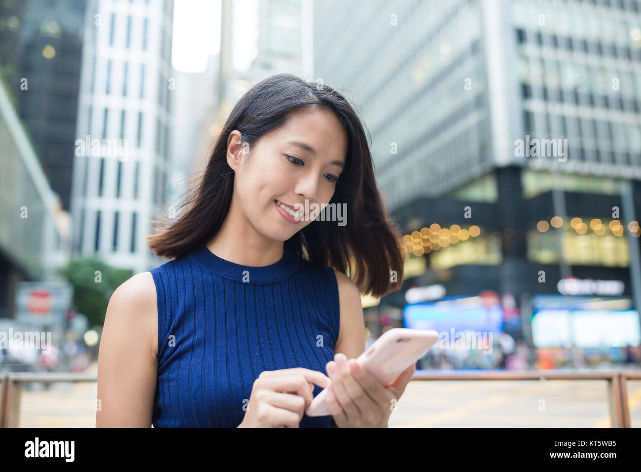 Woman using mobile phone Stock Photo - Alamy