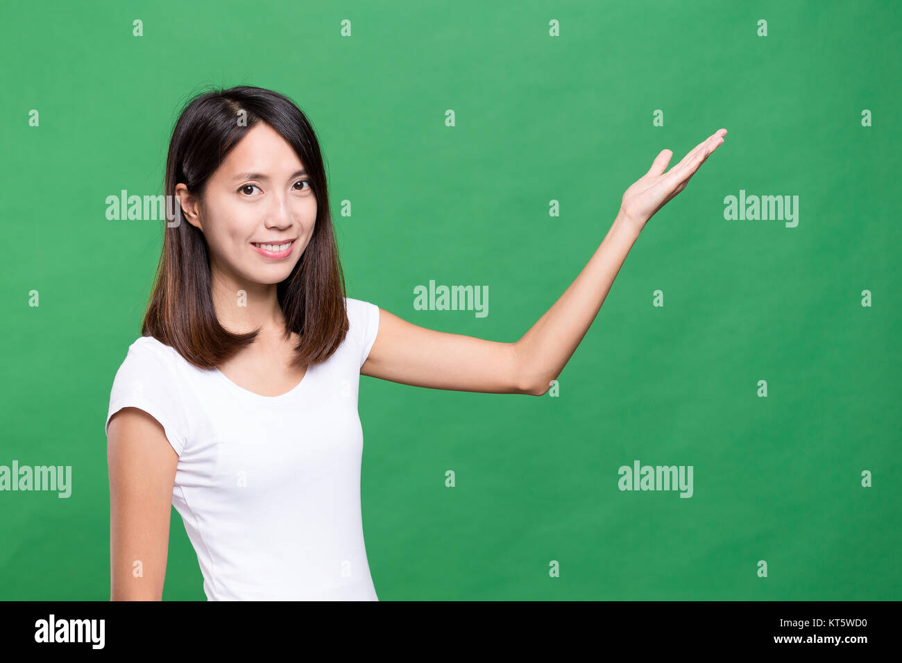 Woman with hand showing blank space Stock Photo - Alamy