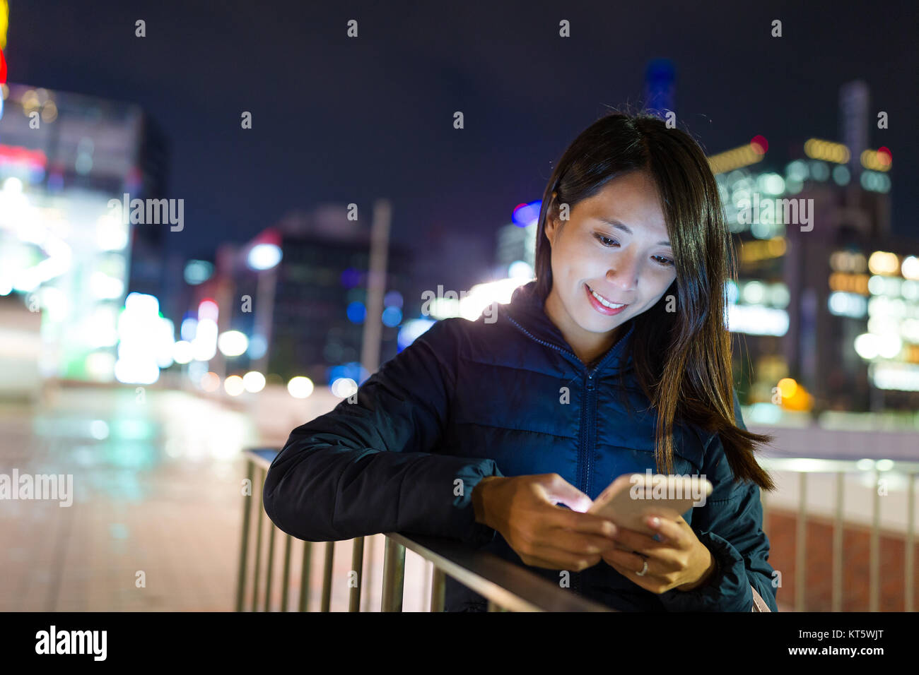 Woman use of mobile phone at night Stock Photo - Alamy