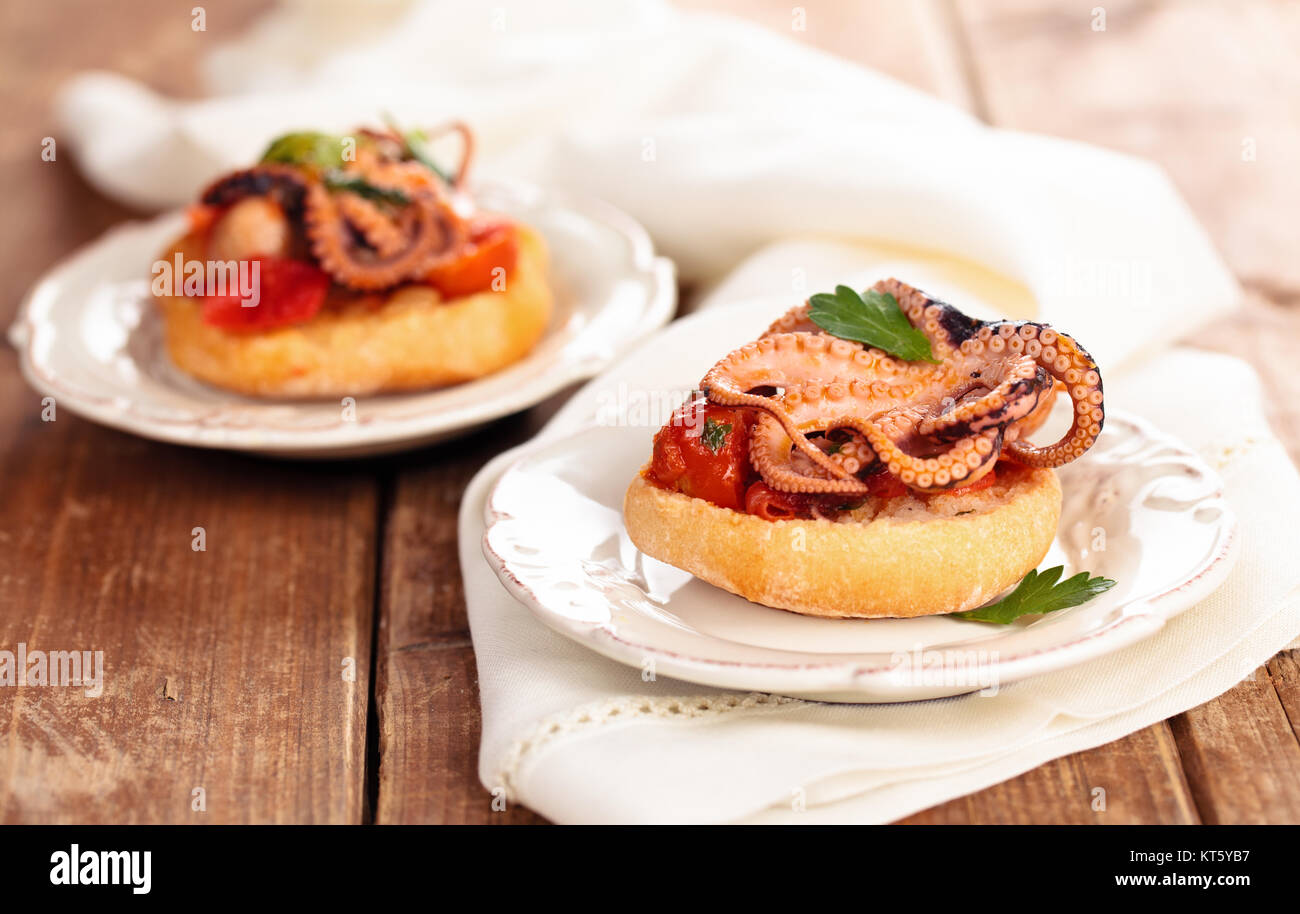 Bruschetta with baby octopuses Stock Photo - Alamy