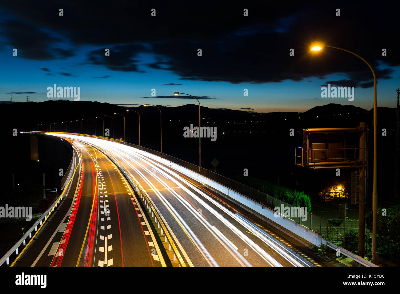 Light trails of evening highway Stock Photo - Alamy