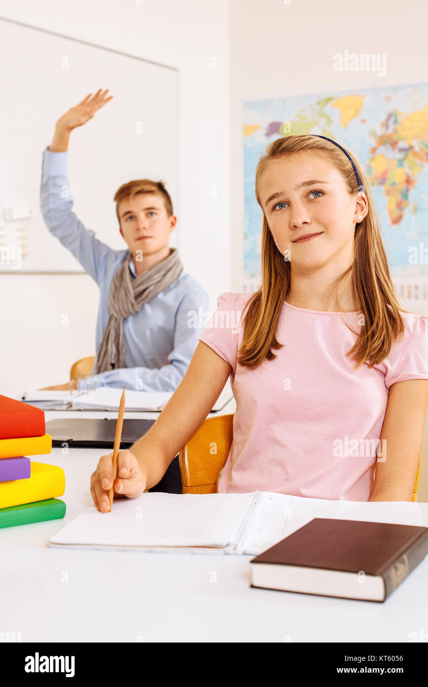 Happy students in the classroom Stock Photo - Alamy