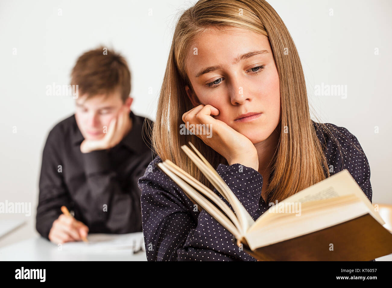 Reading and studying in class Stock Photo - Alamy