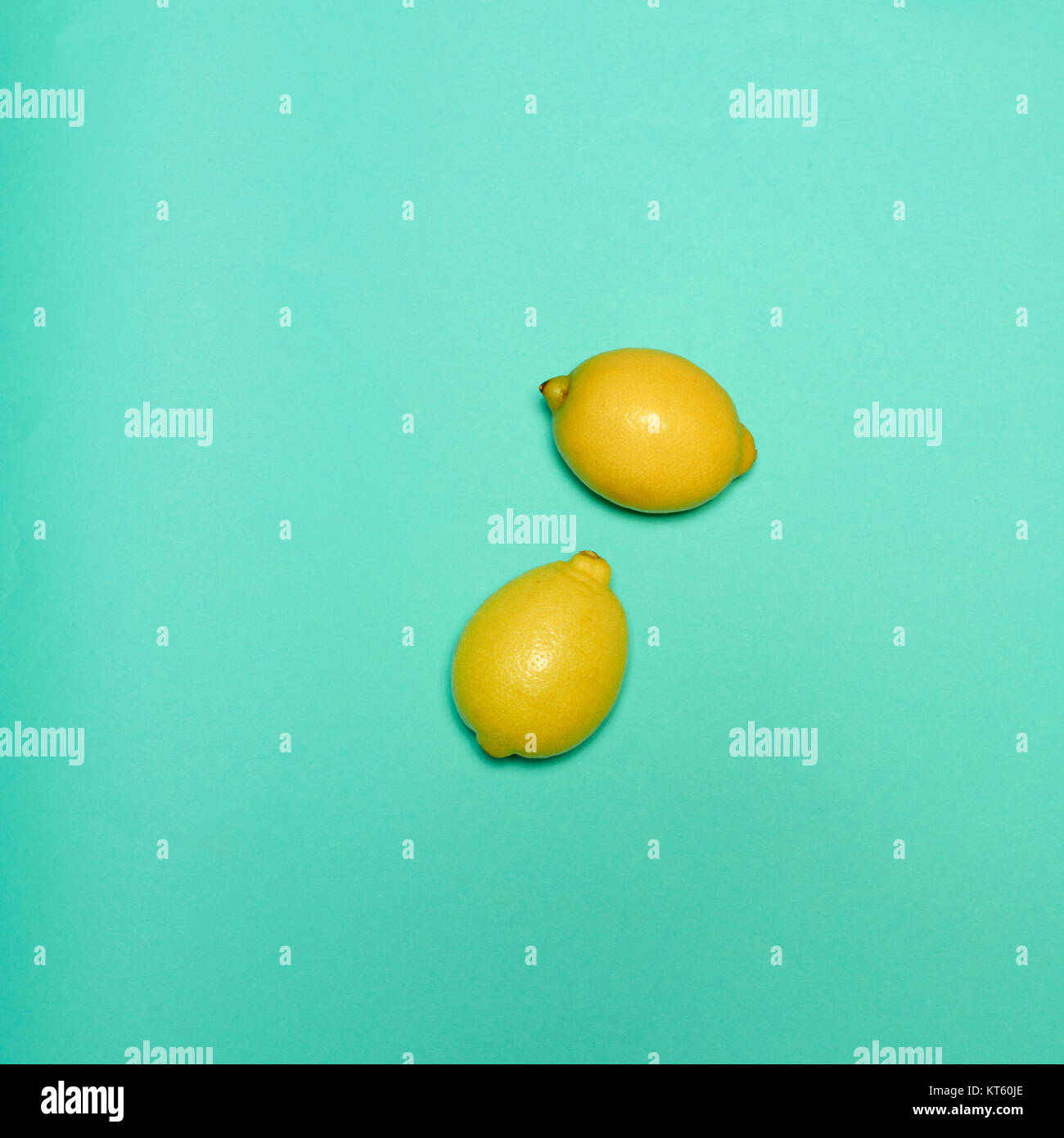 Lemons on blue background Stock Photo - Alamy