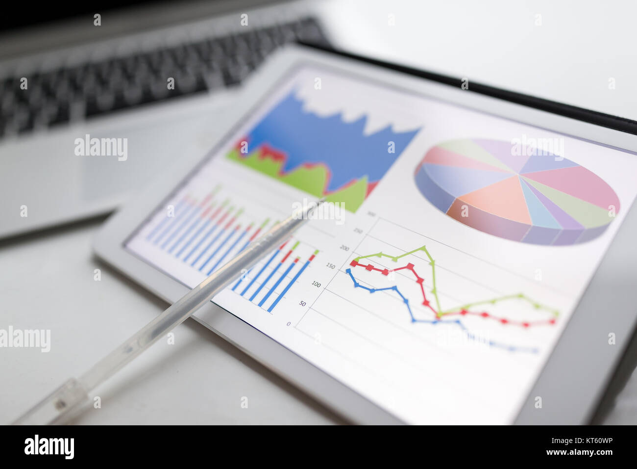 Business concept, tablet with information chart Stock Photo - Alamy