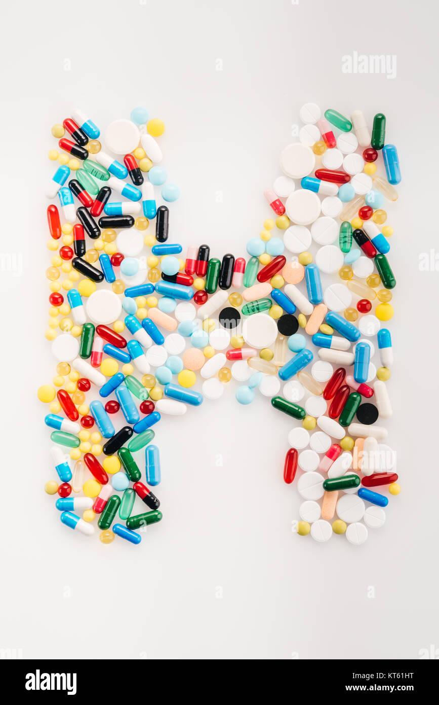 Top view of letter H made from medical pills and capsules, medicine and ...