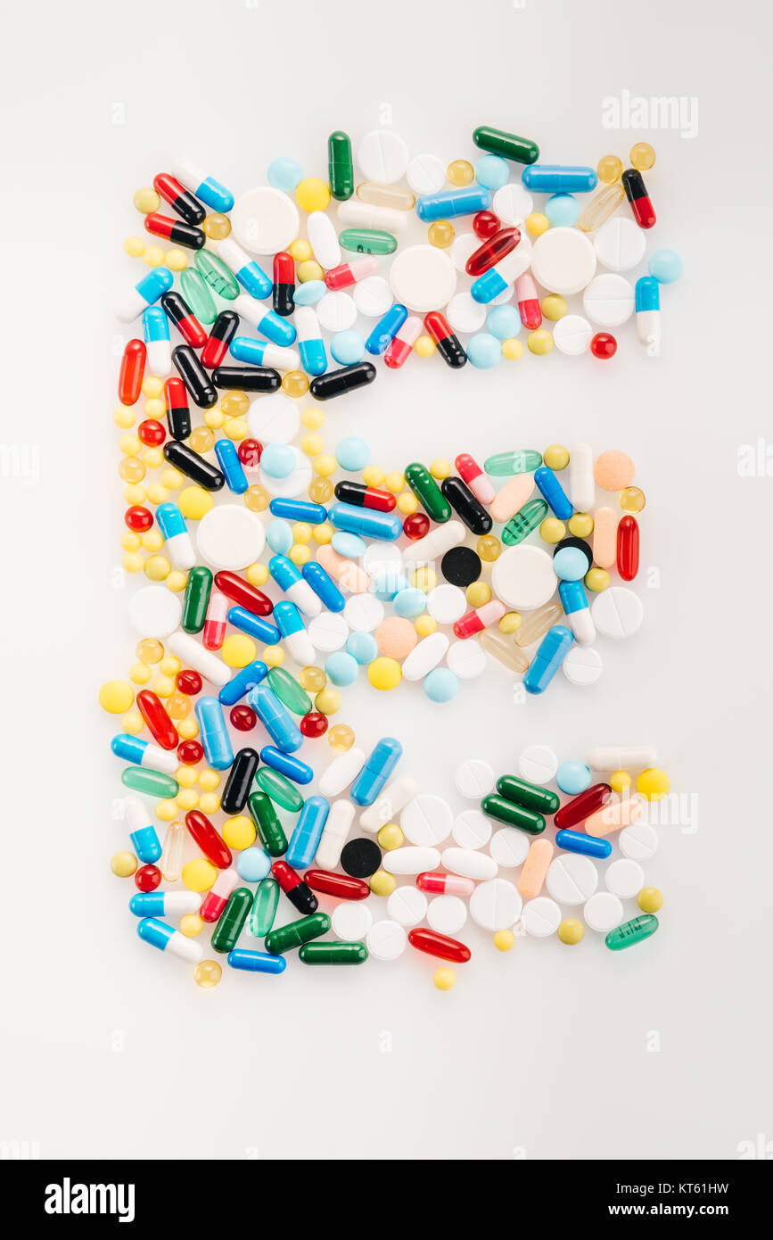 Top view of letter E made from medical pills and capsules, medicine and ...