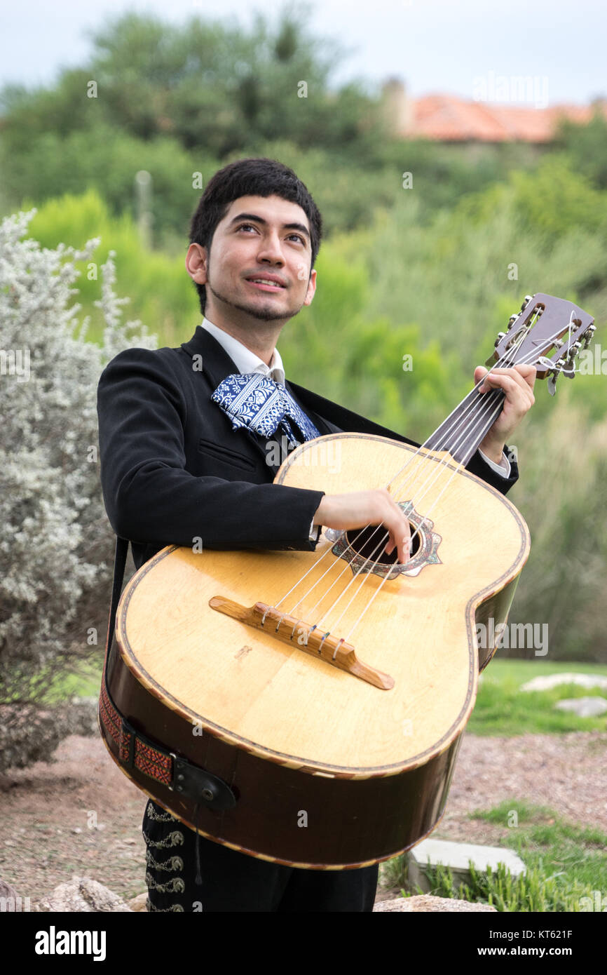 Young Mariachi guitarist playing outdoors Stock Photo - Alamy
