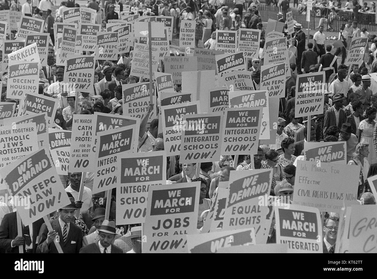 This image captures a moment during a historical march, where many ...