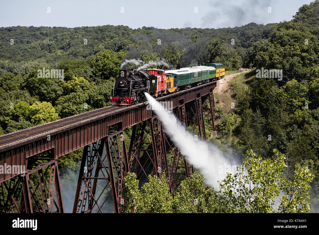 A historic steam train crosses the Bass Point Creek Bridge, a ...