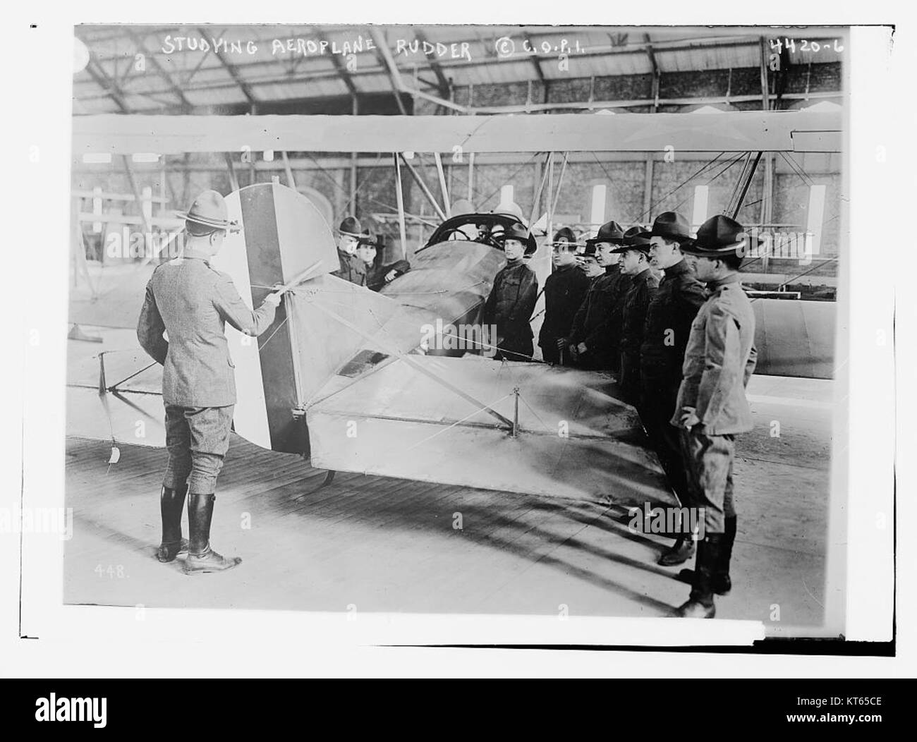 An image showing a person studying an aeroplane rudder, a key component ...
