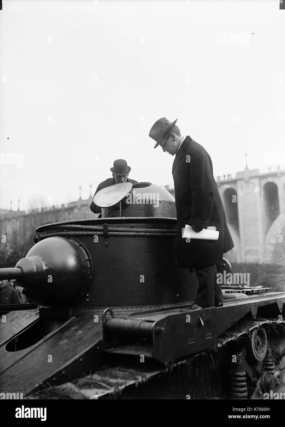 A photograph featuring a tank with the Key Bridge in the background ...