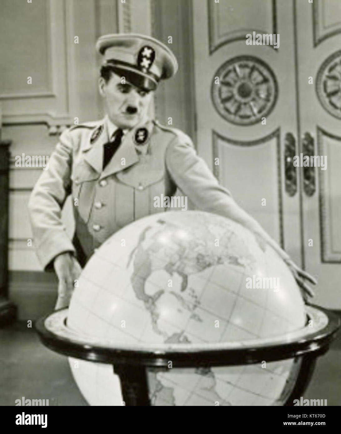 The image shows a cropped still from Charlie Chaplin's 1940 film The ...