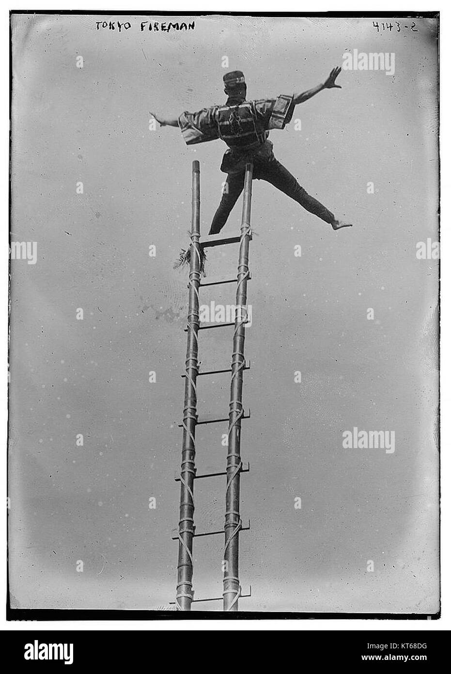 A photograph capturing Tokyo firemen in action. The image highlights ...