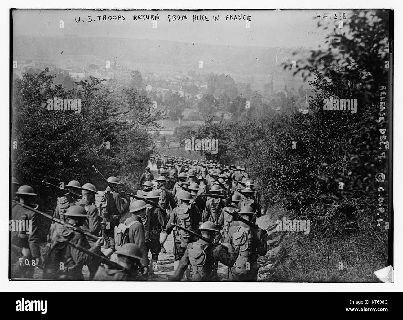 U.S. troops, after a hike in France, return to base. This event ...