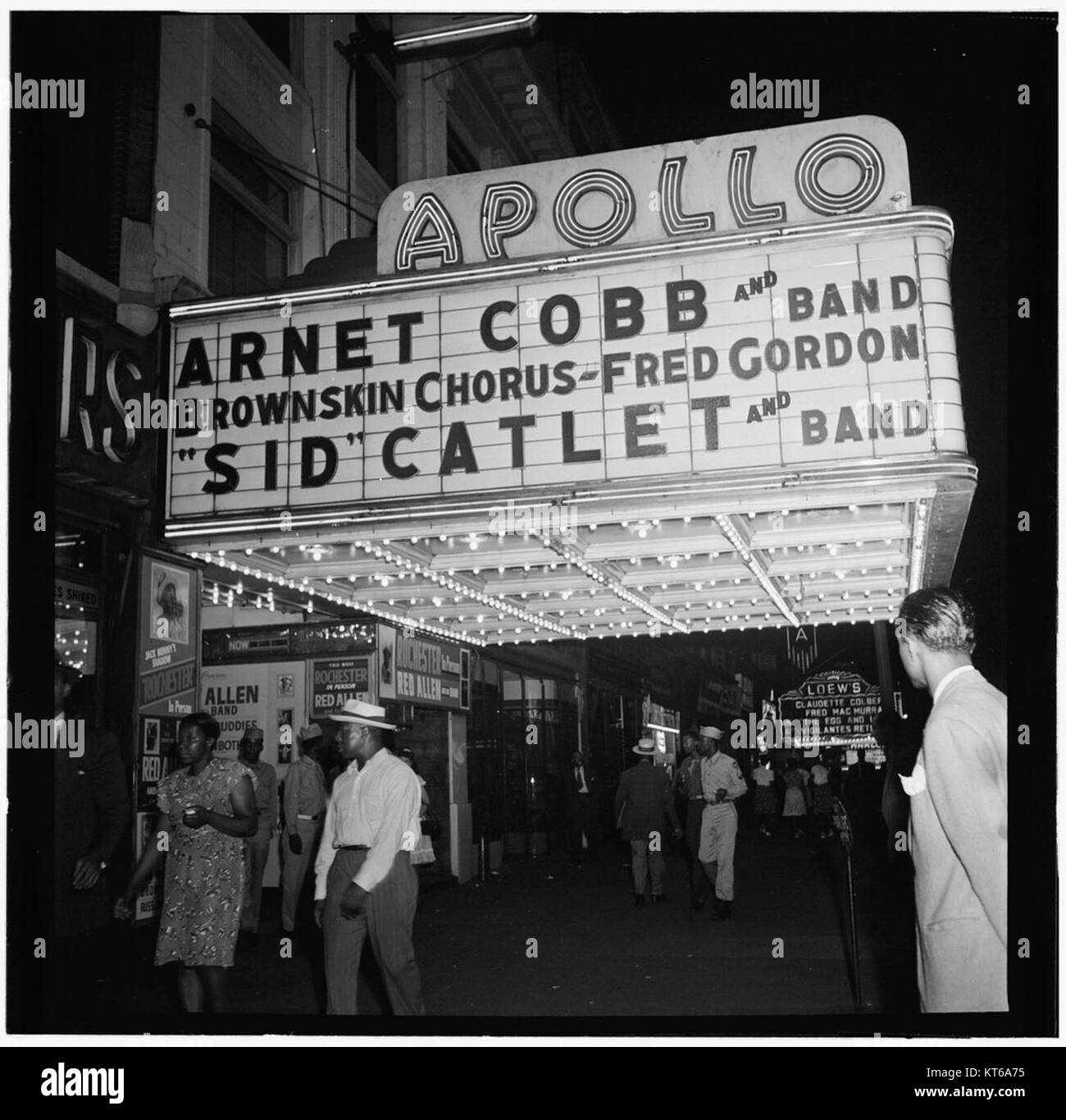 This photograph showcases the marquee of the Apollo Theatre in Harlem ...
