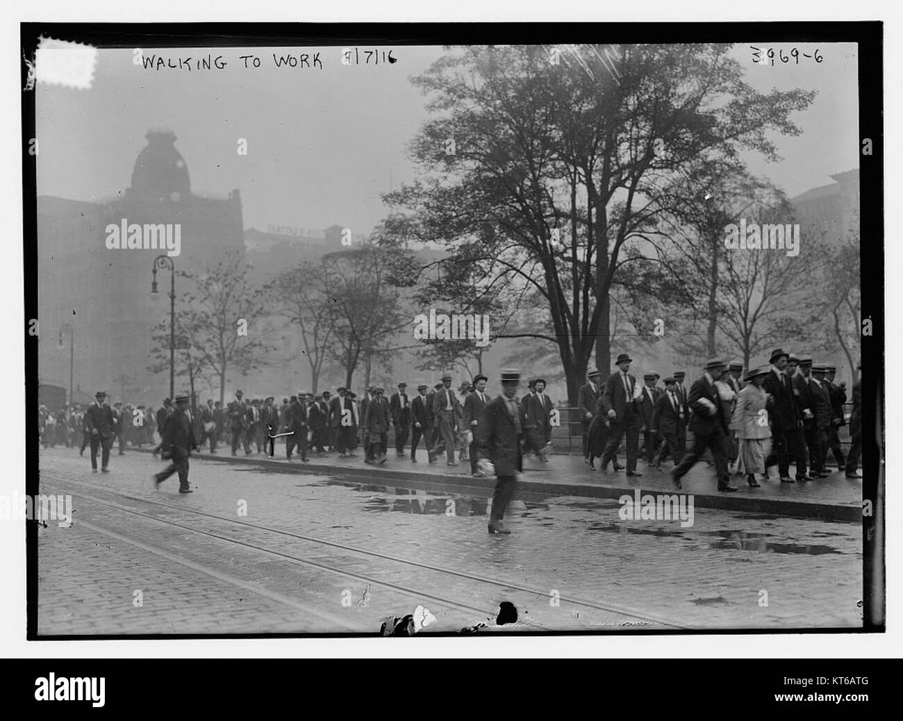 *Walking to Work*, a 1916 photograph, captures the daily life of ...