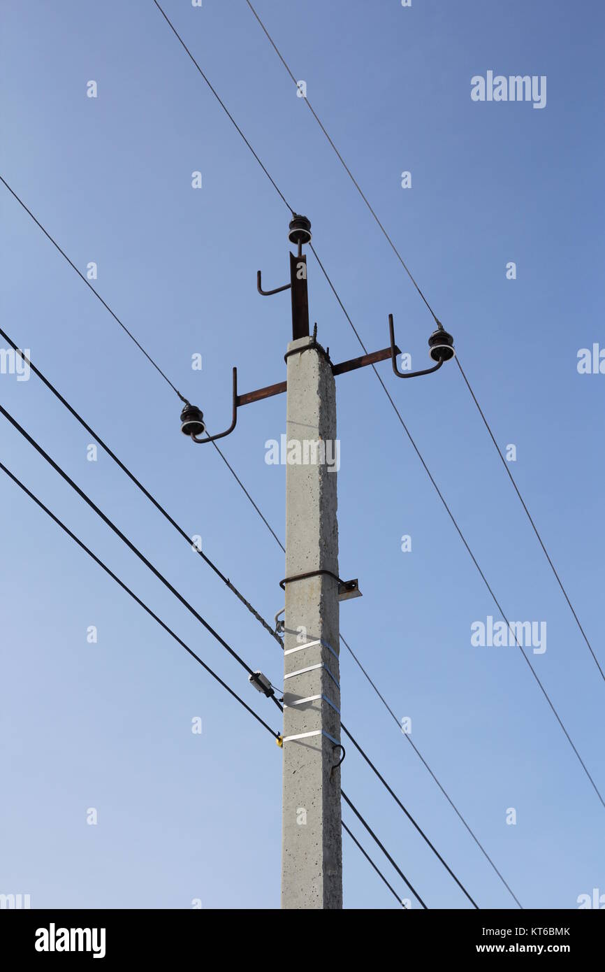Concrete electric pole with wires against the sky Stock Photo - Alamy
