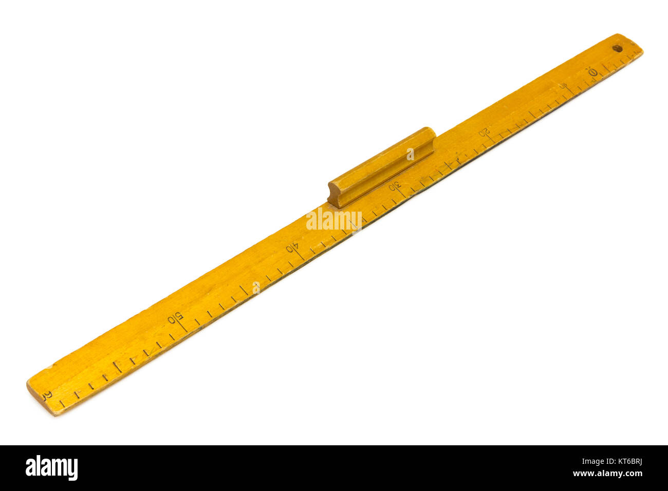 Yellow wooden measuring ruler on a white background Stock Photo - Alamy